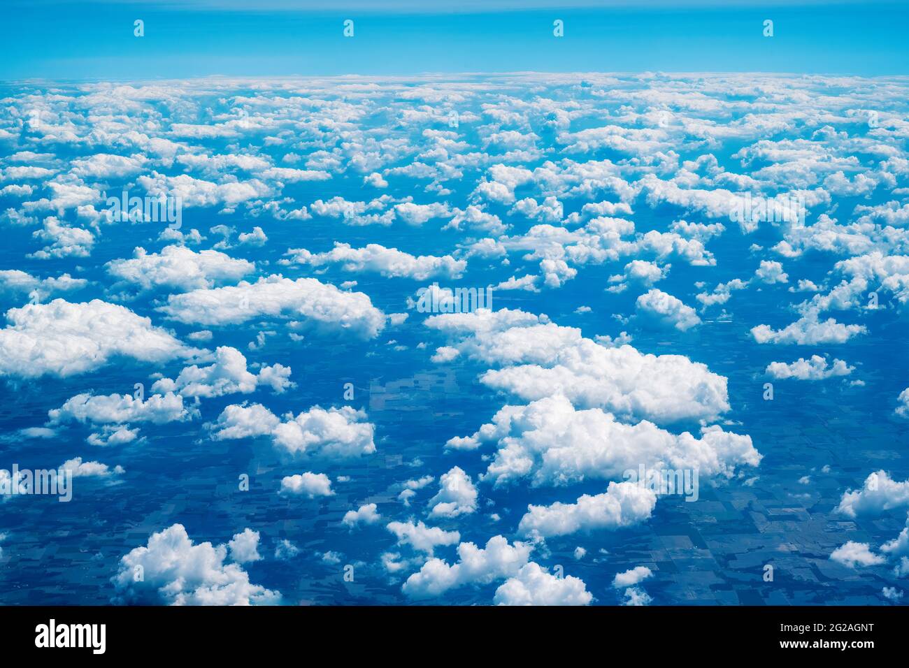 Travel concept. A beautiful view from an airplane on white voluminous ...