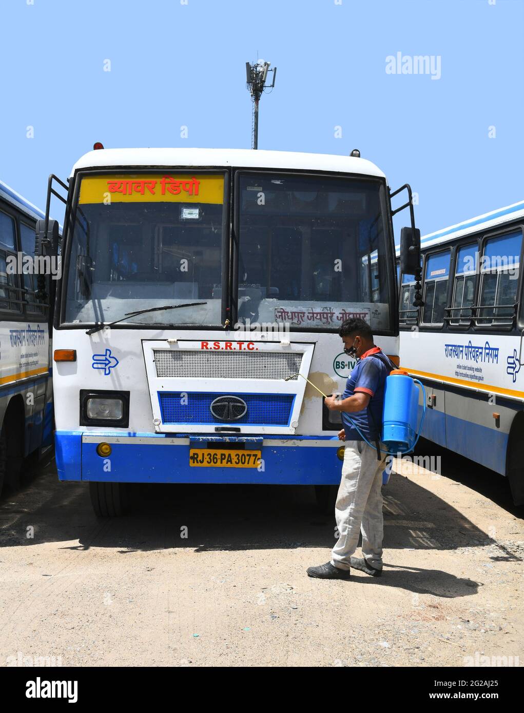 Beawar, Rajasthan, India, June 9, 2021: Worker sanitize a bus at ...