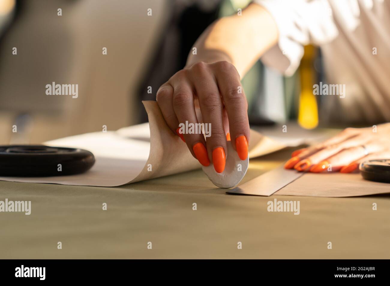 Tailoring process in atelier workshop: sewer draft clothes model on ...