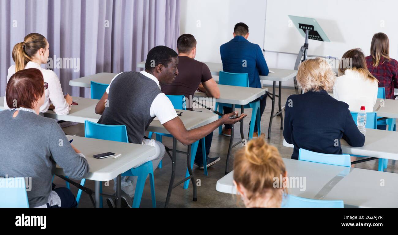 Back view of students in classroom Stock Photo - Alamy
