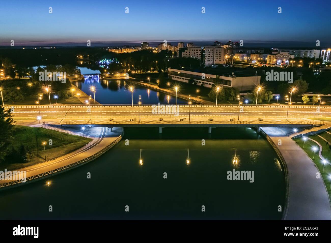 panoramic night cityscape with bridge over Svisloch river. Minsk ...