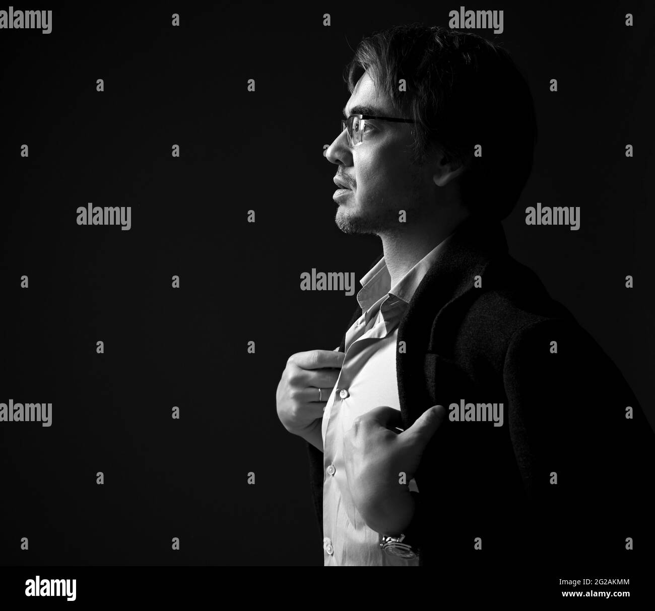 Black and white portrait of adult man poet, writer standing sideways in ...