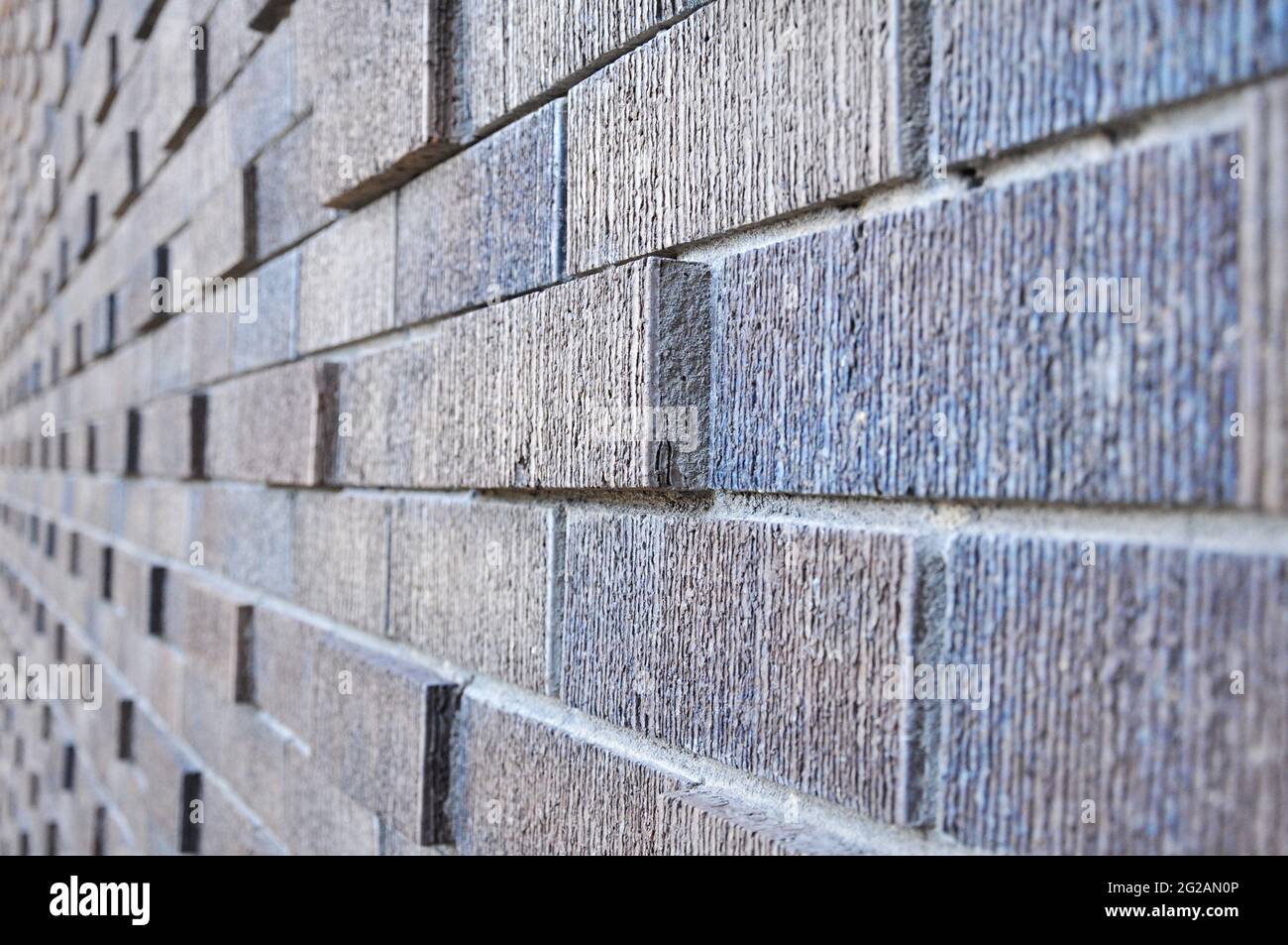 Side view of abstract brick wall - background Stock Photo - Alamy