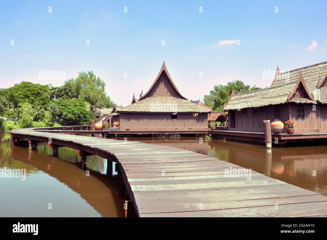 Ancient Thai style wooden houses above the pond - Floating village ...