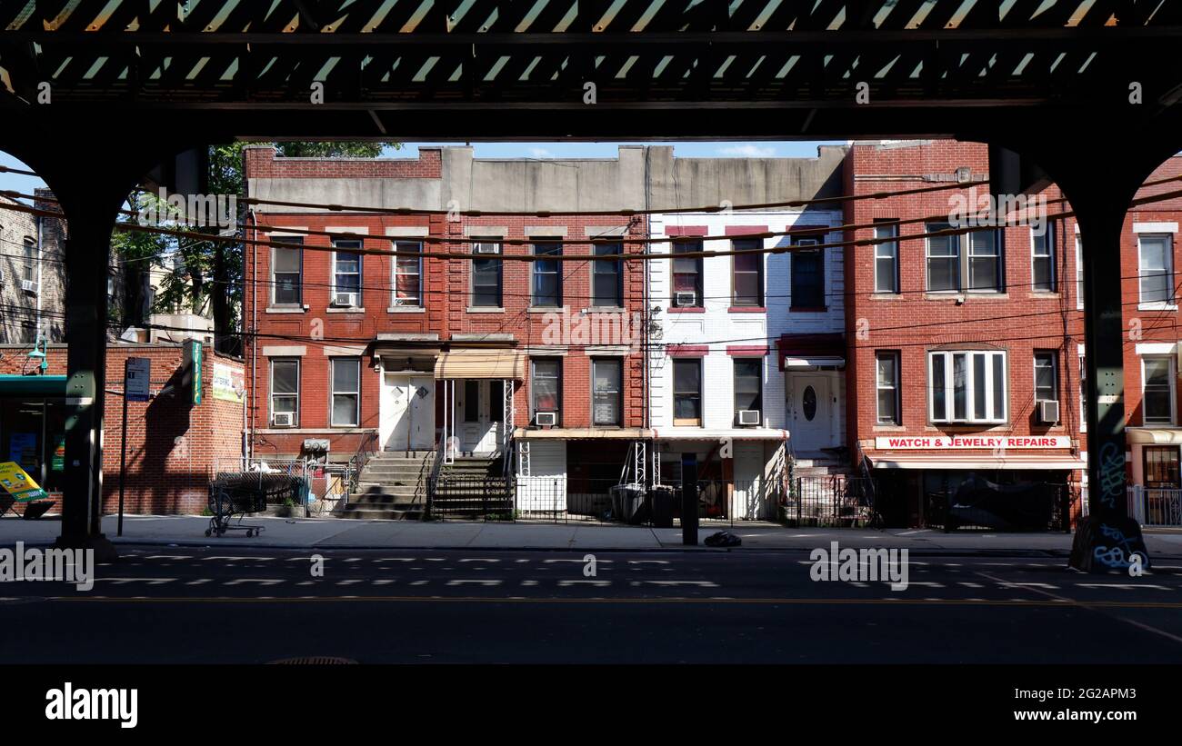 Residential 2-story houses on 31st St under the elevated subway train ...
