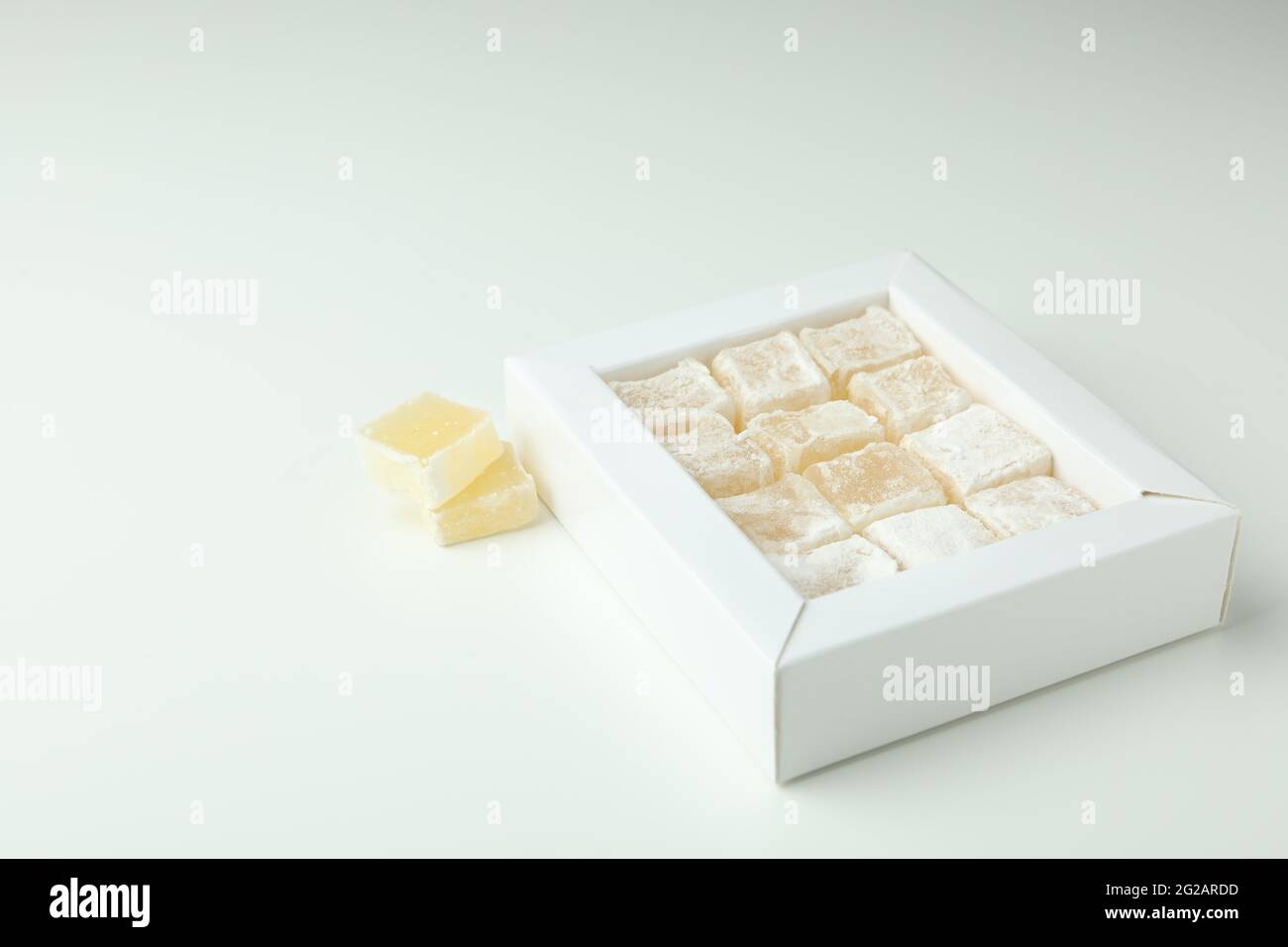 Delicious turkish delight cubes on white background Stock Photo - Alamy