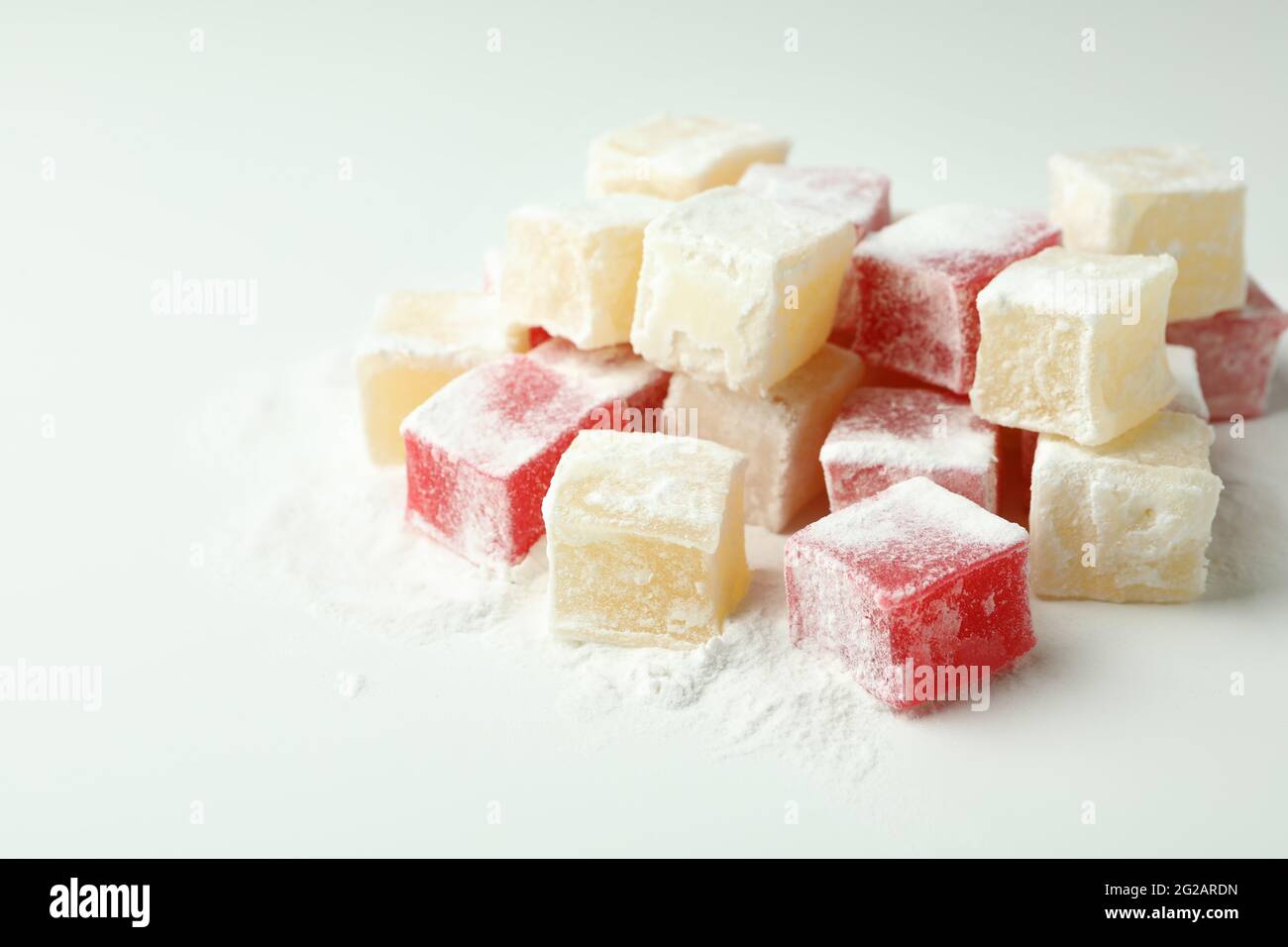 Delicious turkish delight cubes on white background Stock Photo - Alamy