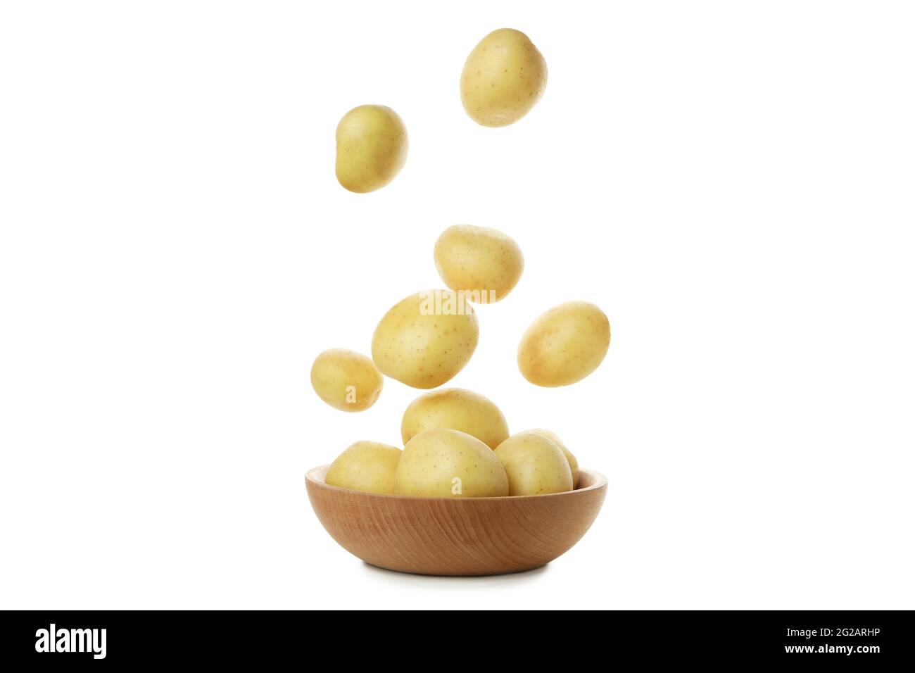 Bowl and falling young potato isolated on white background Stock Photo ...