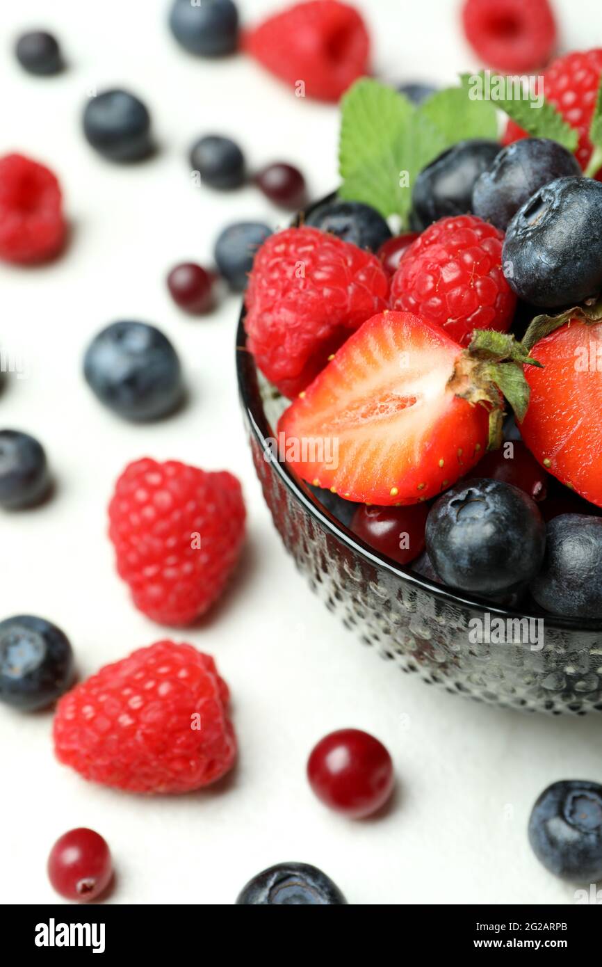 Bowl with berry mix on white background Stock Photo - Alamy