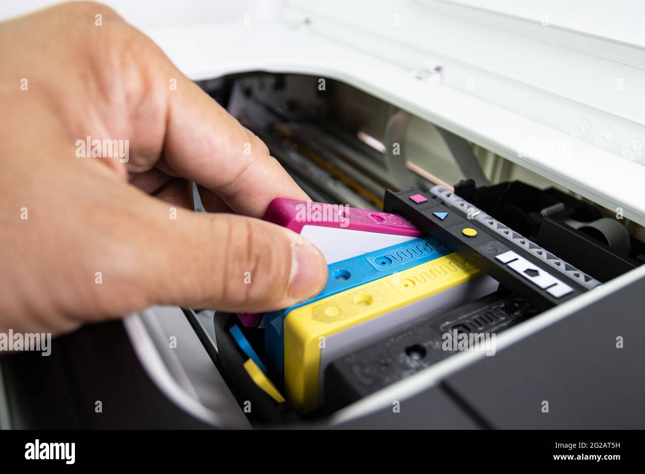 Technicians are install setup the ink cartridge of a inkjet printer the ...
