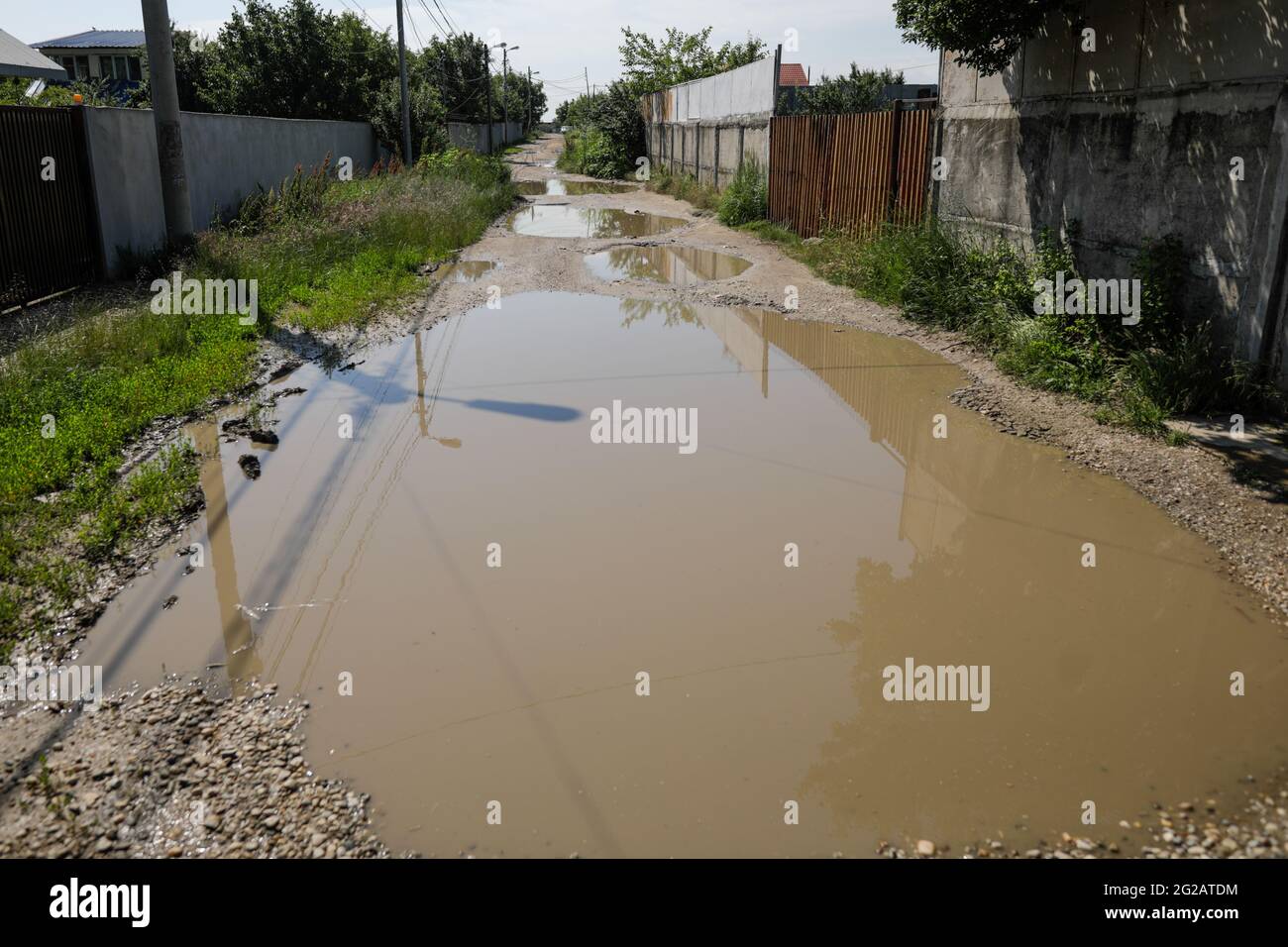 Rain filled pothole hi-res stock photography and images - Alamy