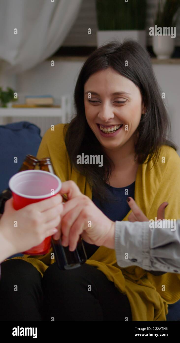 Multi-cultural friends socialising while hanging out late at night in ...