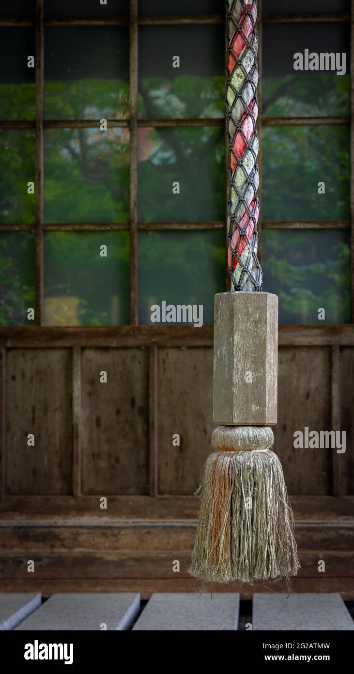 A decorative rope hangs from a building near the Myohoji Temple in ...