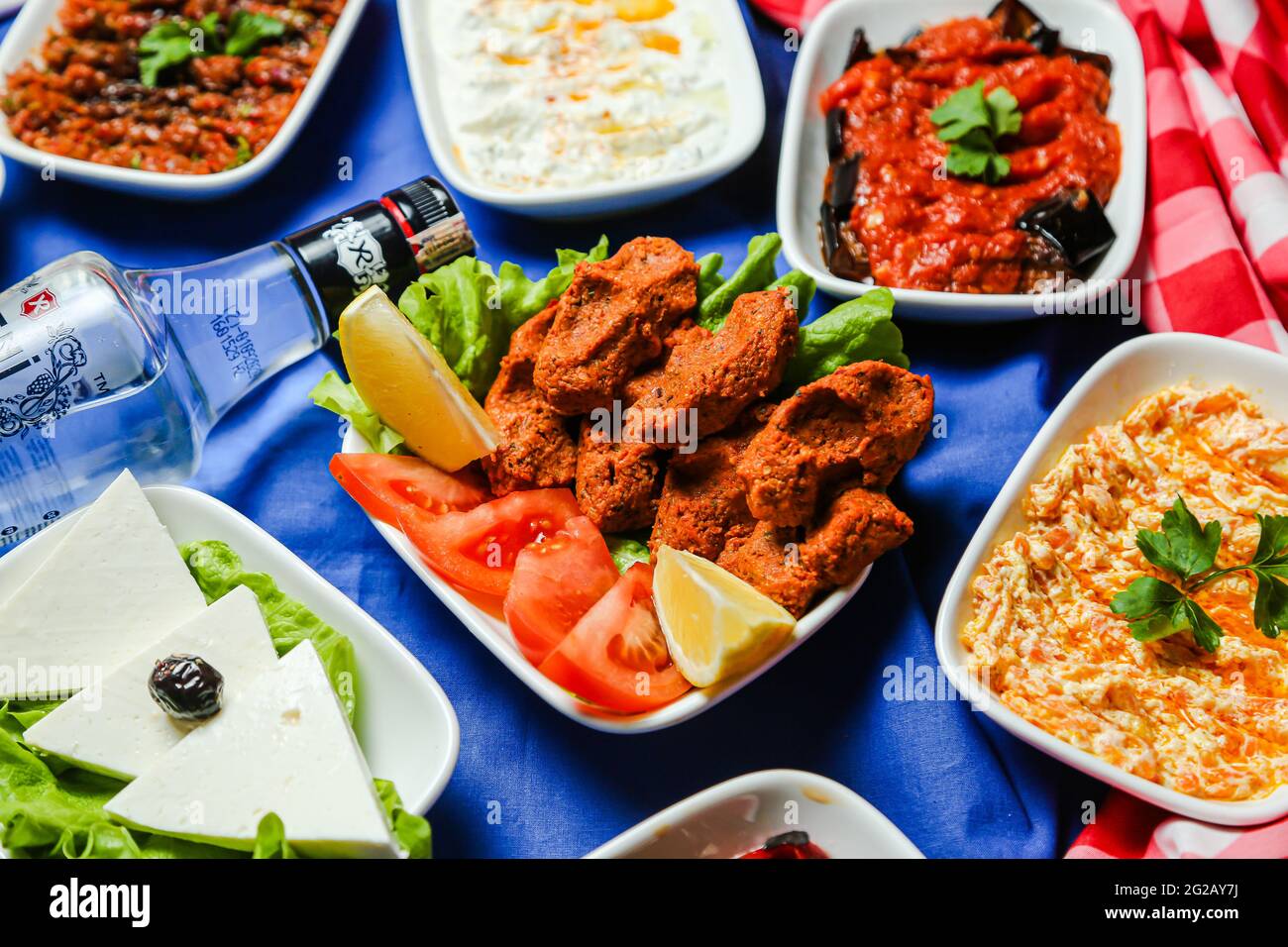 Cig kofte, a raw meat dish in Turkish with turkish drink Stock Photo ...