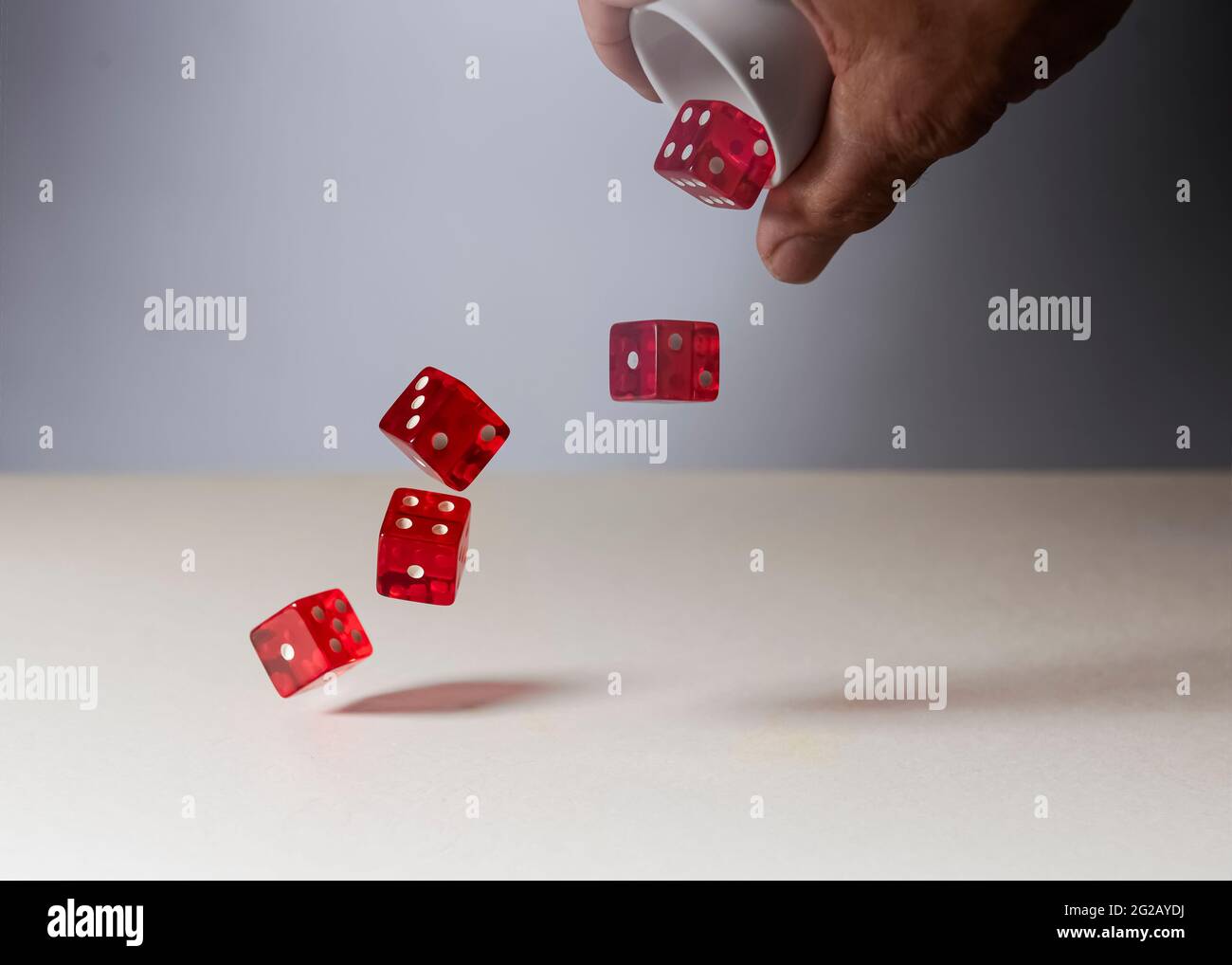 Hand rolling dice hi-res stock photography and images - Alamy