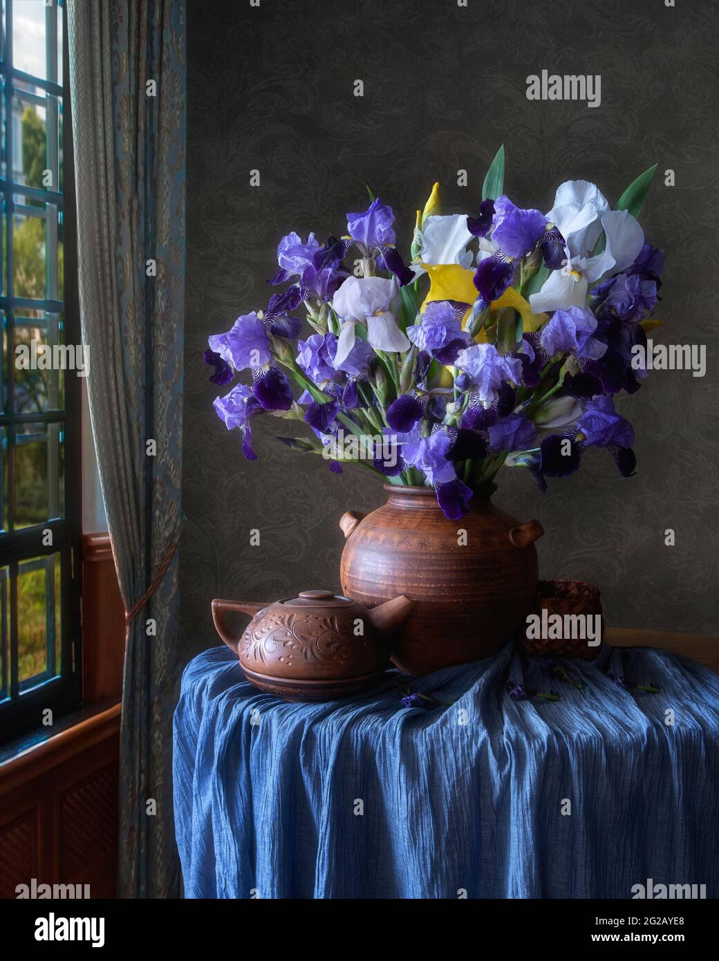 Still life with bouquet of iris flowers Stock Photo - Alamy