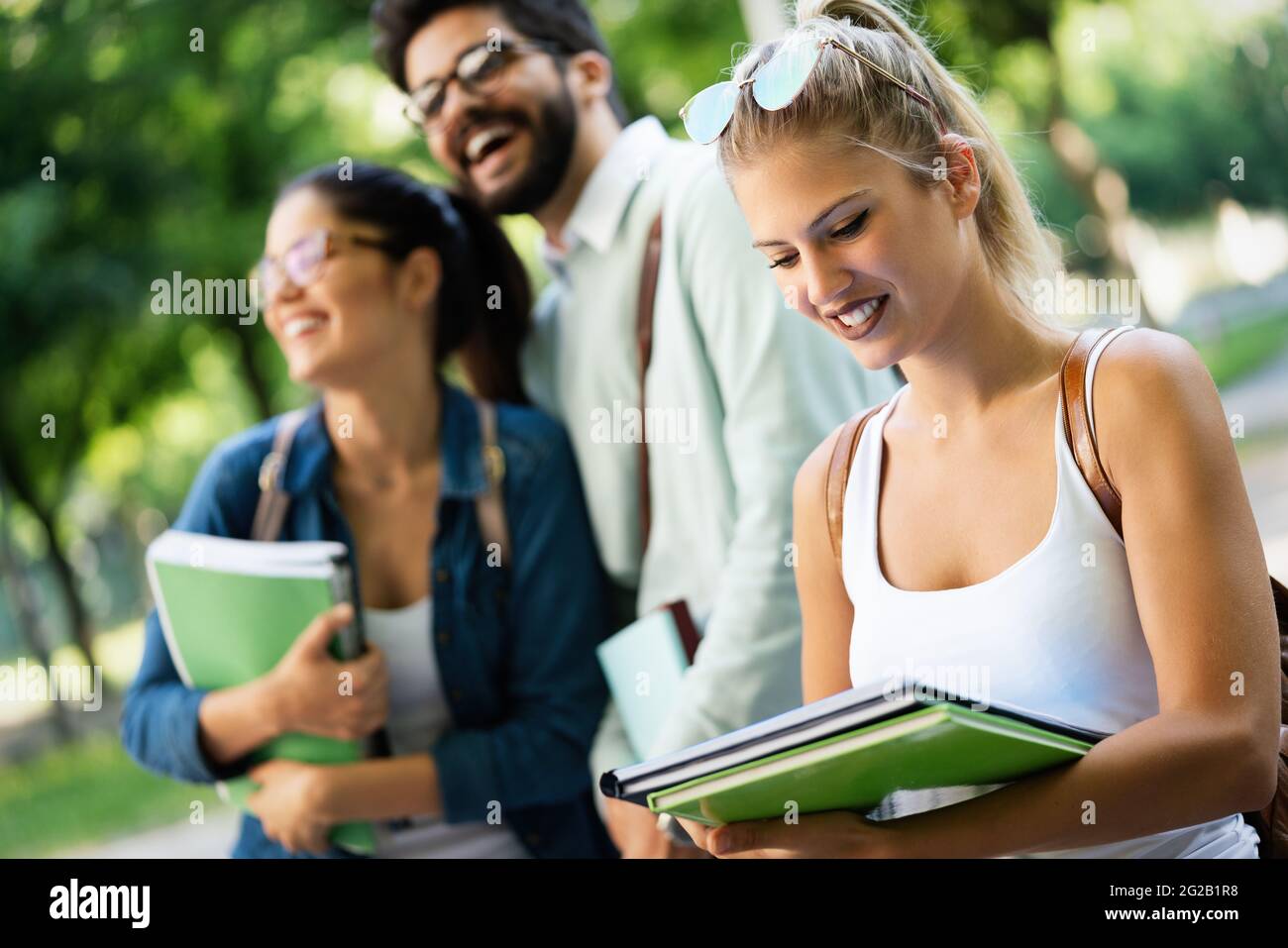 College students studying on university campus outdoor Stock Photo - Alamy