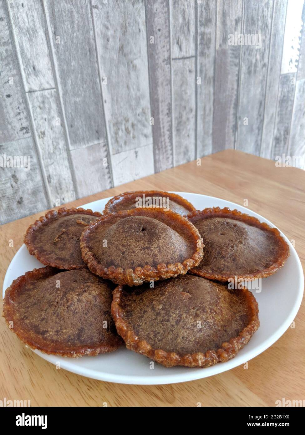 Vertical shot of cucur, a traditional north Sulawesi cake on a table ...