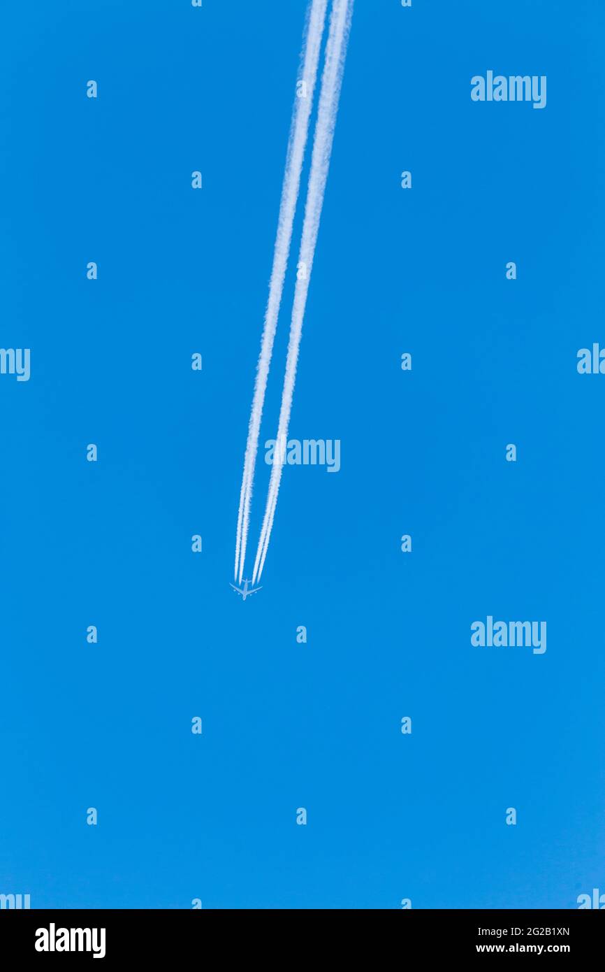Boeing 747 Freighter at High Altitude in a Clear Blue Sky with intense ...