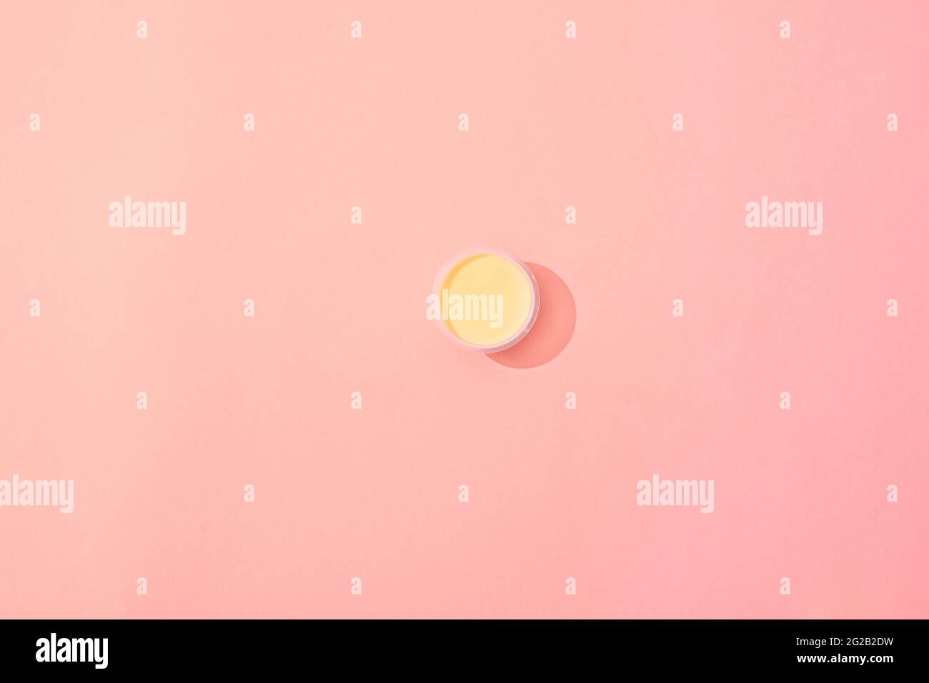 Minimalist style setup of creme caramel on pink background Stock Photo ...
