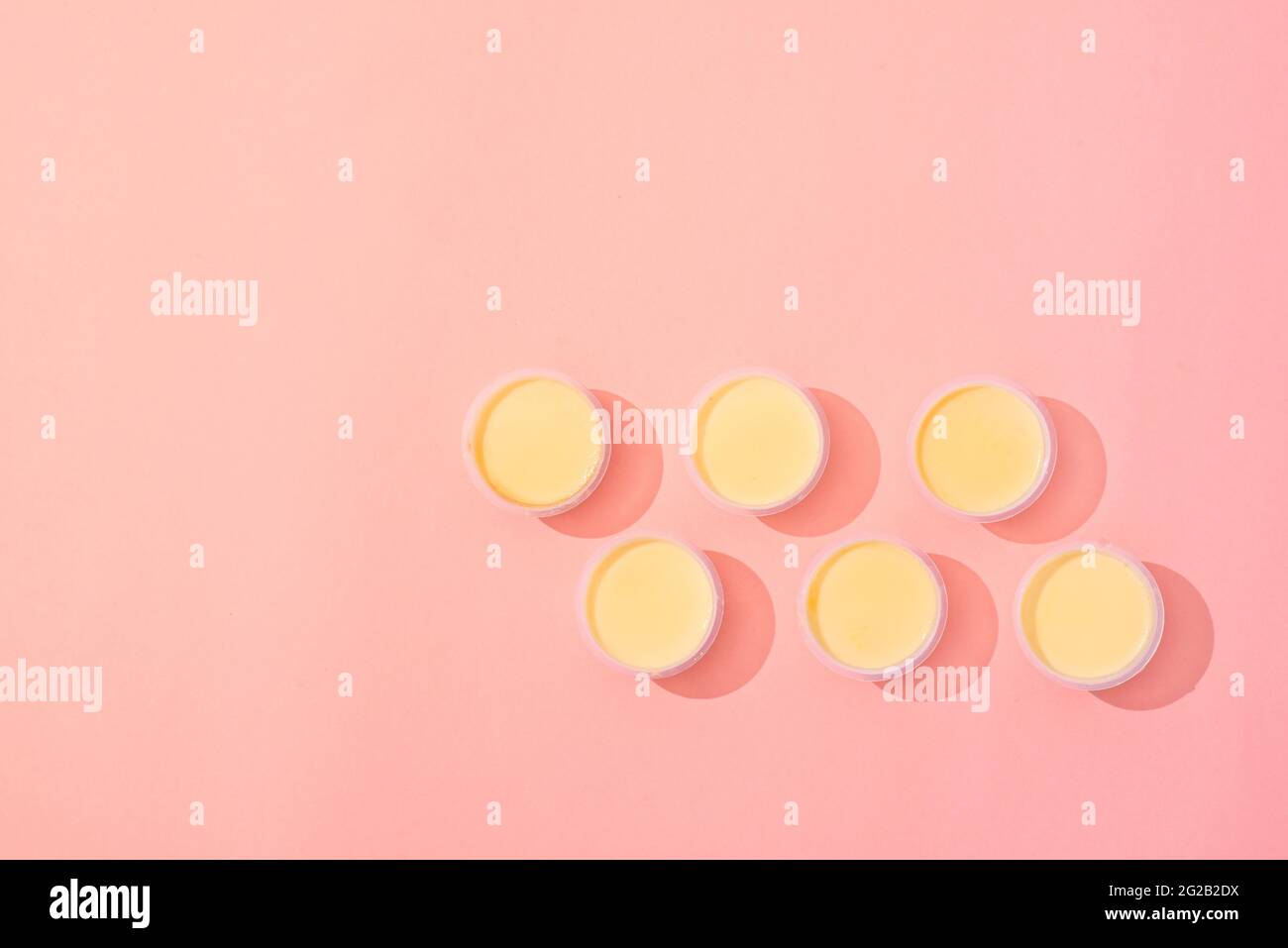 Minimalist style setup of creme caramel on pink background Stock Photo ...