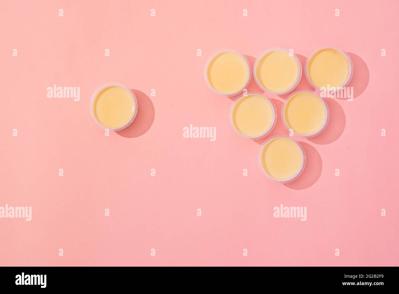 Minimalist style setup of creme caramel on pink background Stock Photo ...