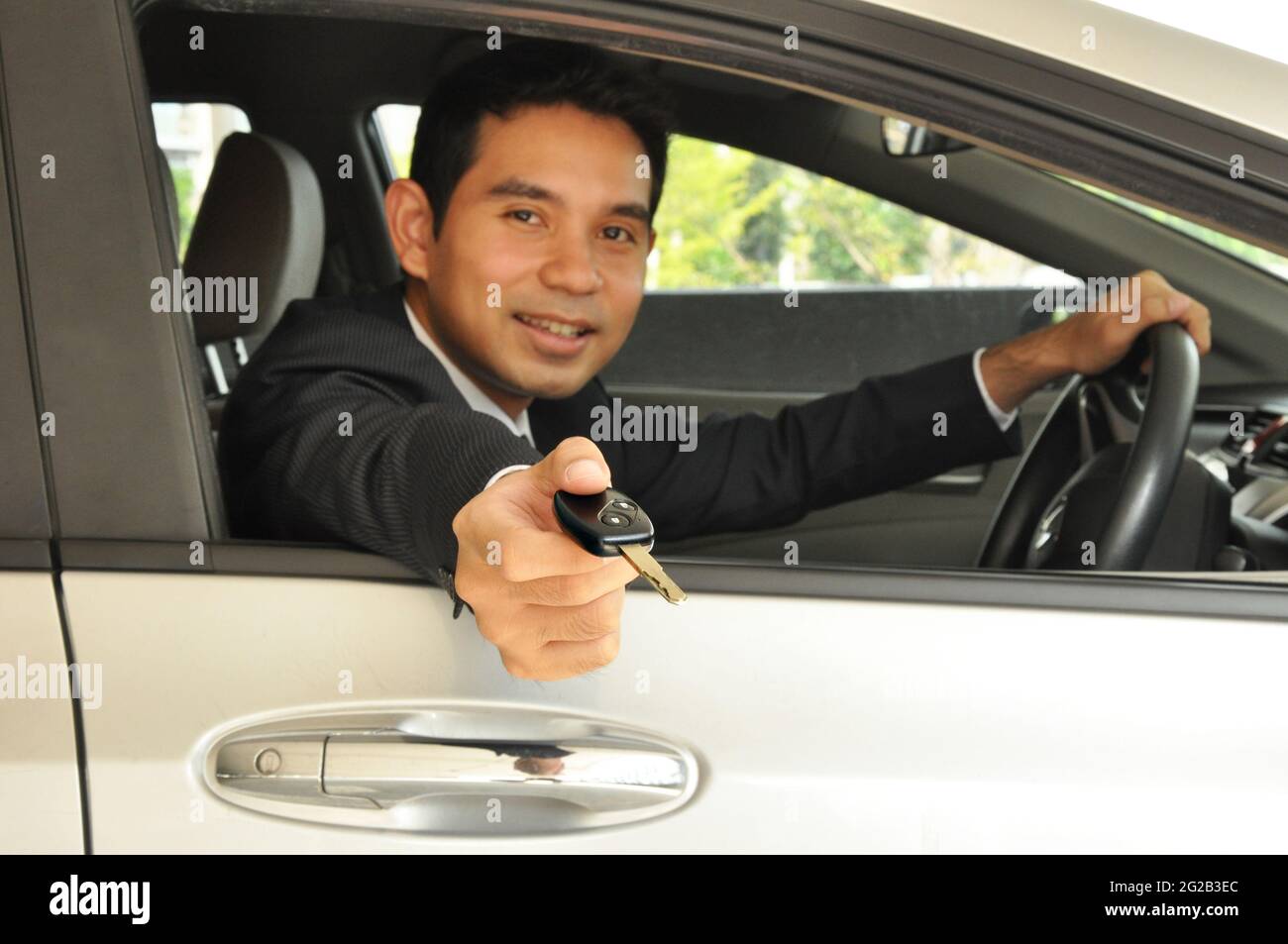 Car dealer giving key client hi-res stock photography and images - Alamy