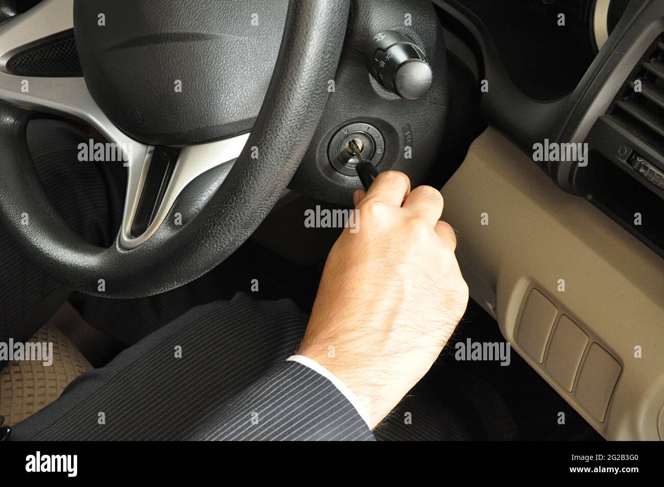 Businessman starting the car Stock Photo - Alamy