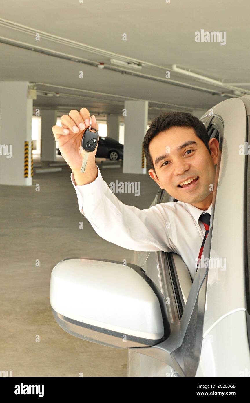 Car salesman giving key new hi-res stock photography and images - Alamy