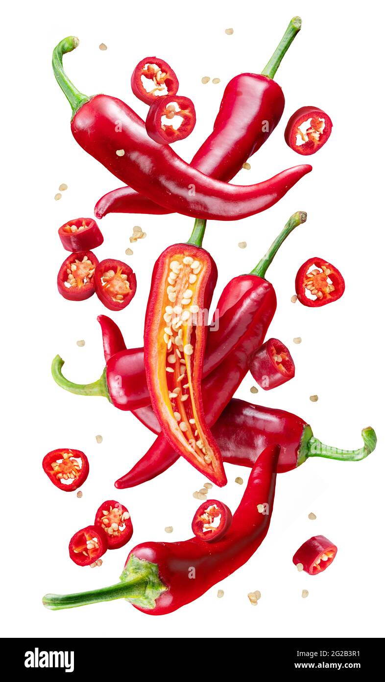 Fresh red chilli peppers and cross sections of chilli pepper with seeds ...