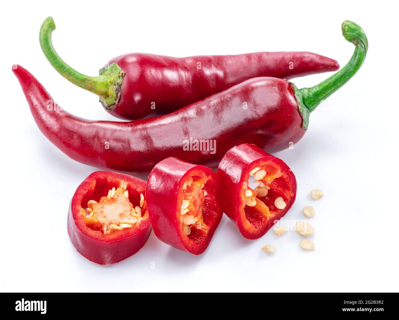 Fresh red chilli pepper and cross sections of chilli pepper with seeds ...