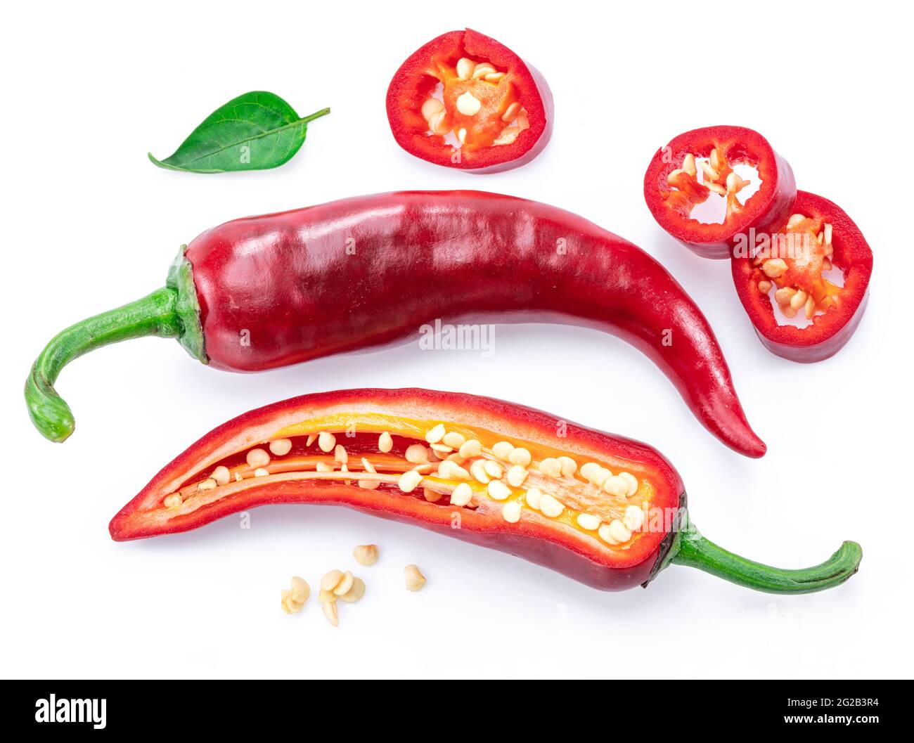 Fresh red chilli pepper and cross sections of chilli pepper with seeds ...