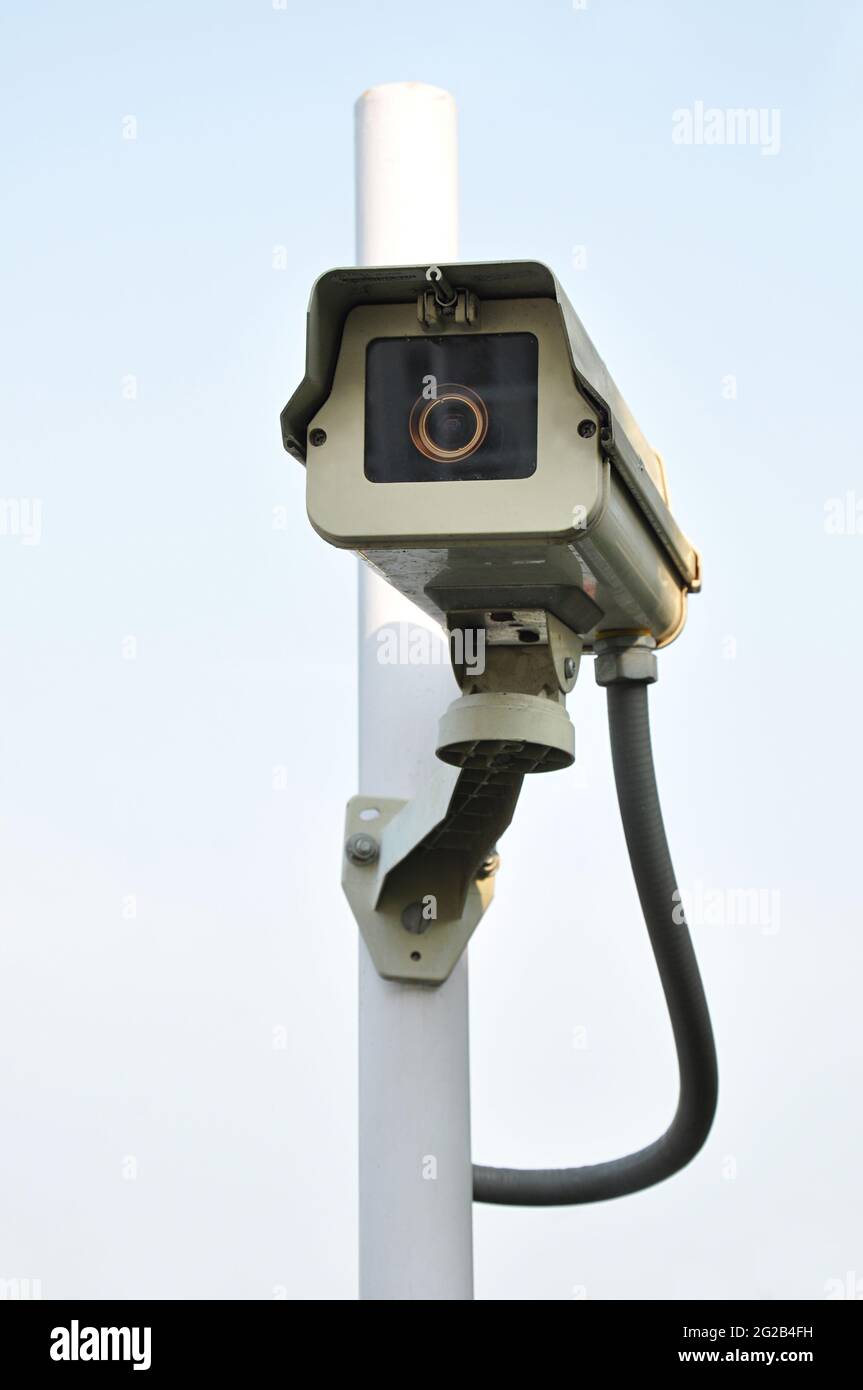 CCTV on white post Stock Photo - Alamy