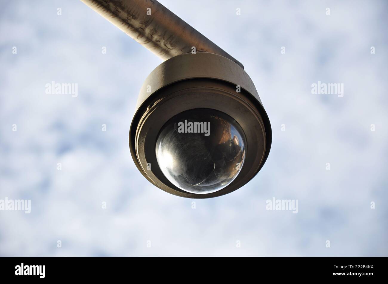 Round shape CCTV on cloudy sky background Stock Photo - Alamy