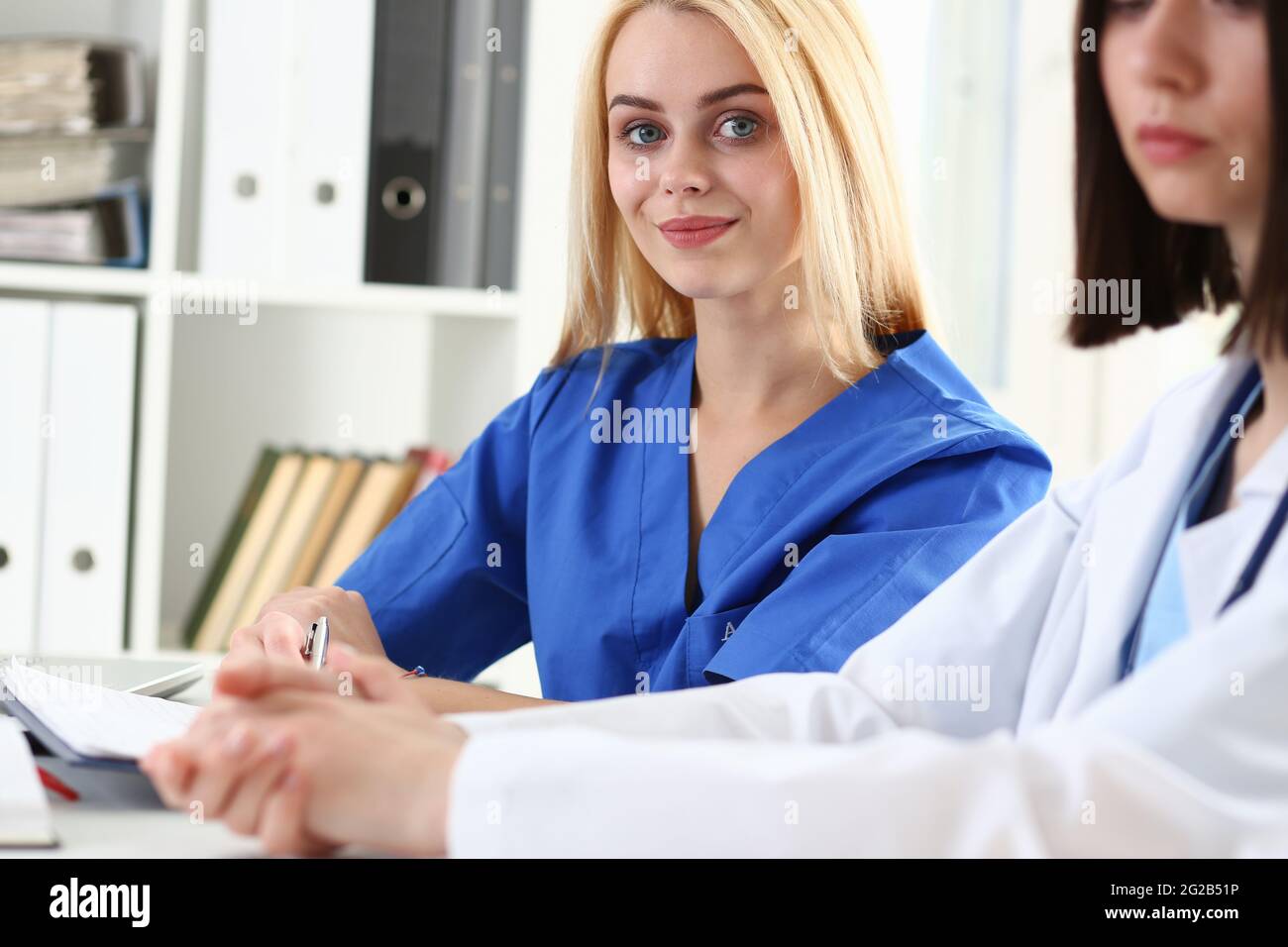 Group of doctors talking during conference portrait Stock Photo - Alamy
