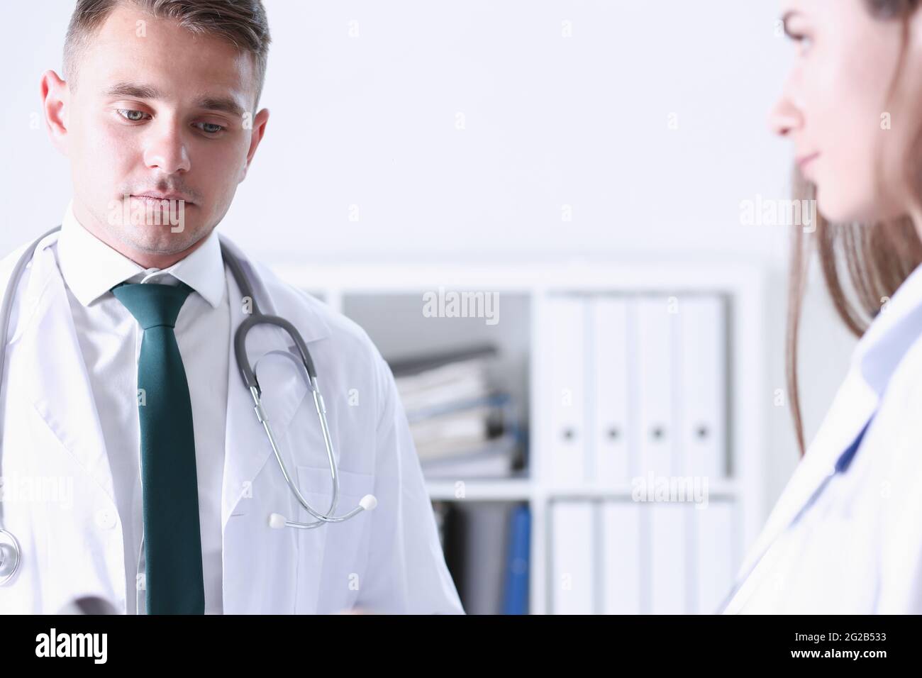 Group medical team talking examine hi-res stock photography and images ...