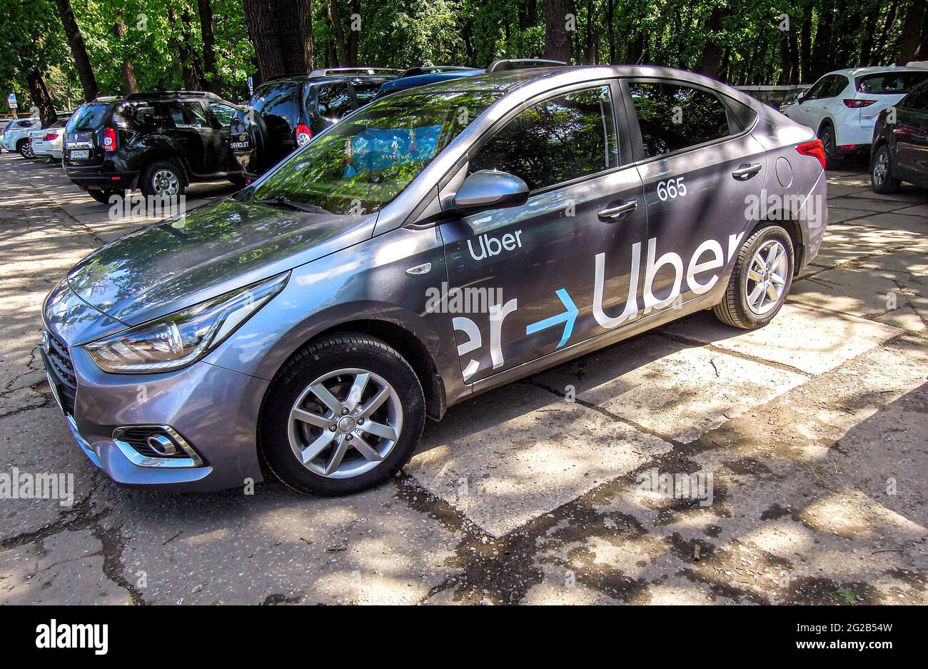 Samara, Russia - June 5, 2021: Uber taxi is parked on a city street in ...