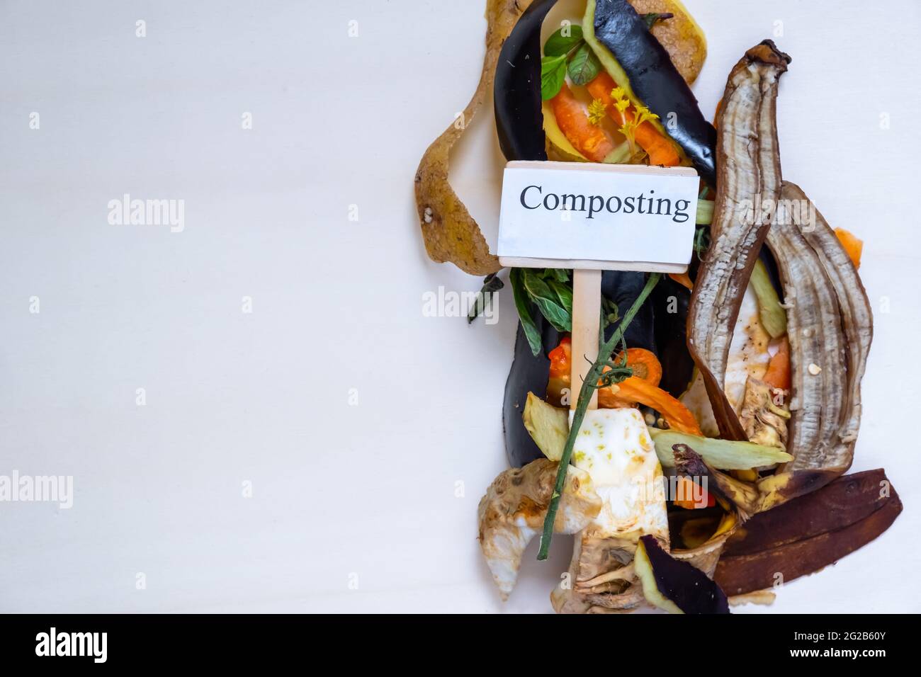 Organic food waste. Paper bag with vegetable leftovers for compost ...