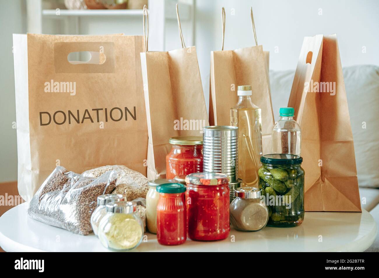 A Food donation in the paper bag Stock Photo - Alamy
