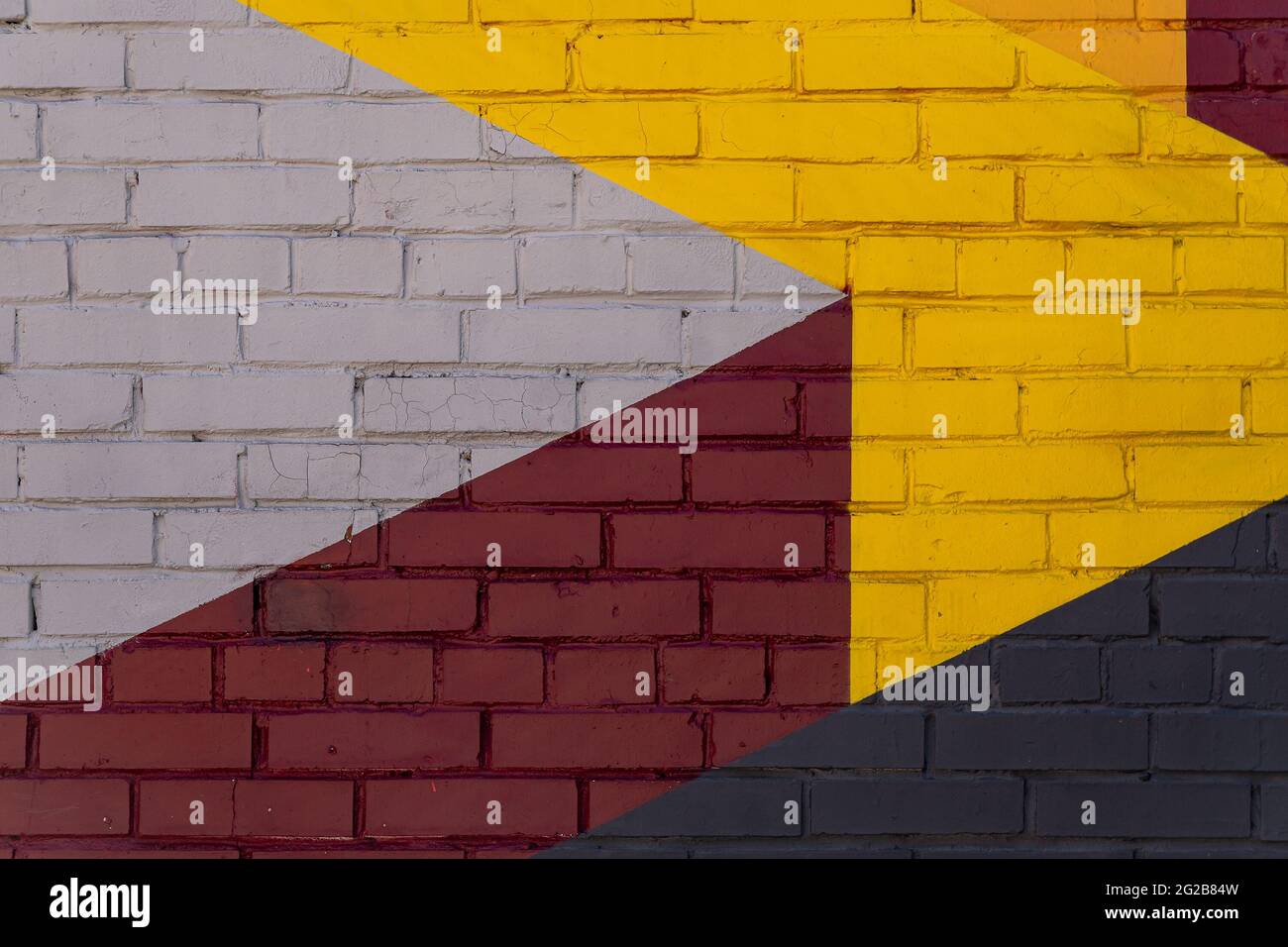 Colorful grey, red, yellow brick wall as background, texture Stock ...