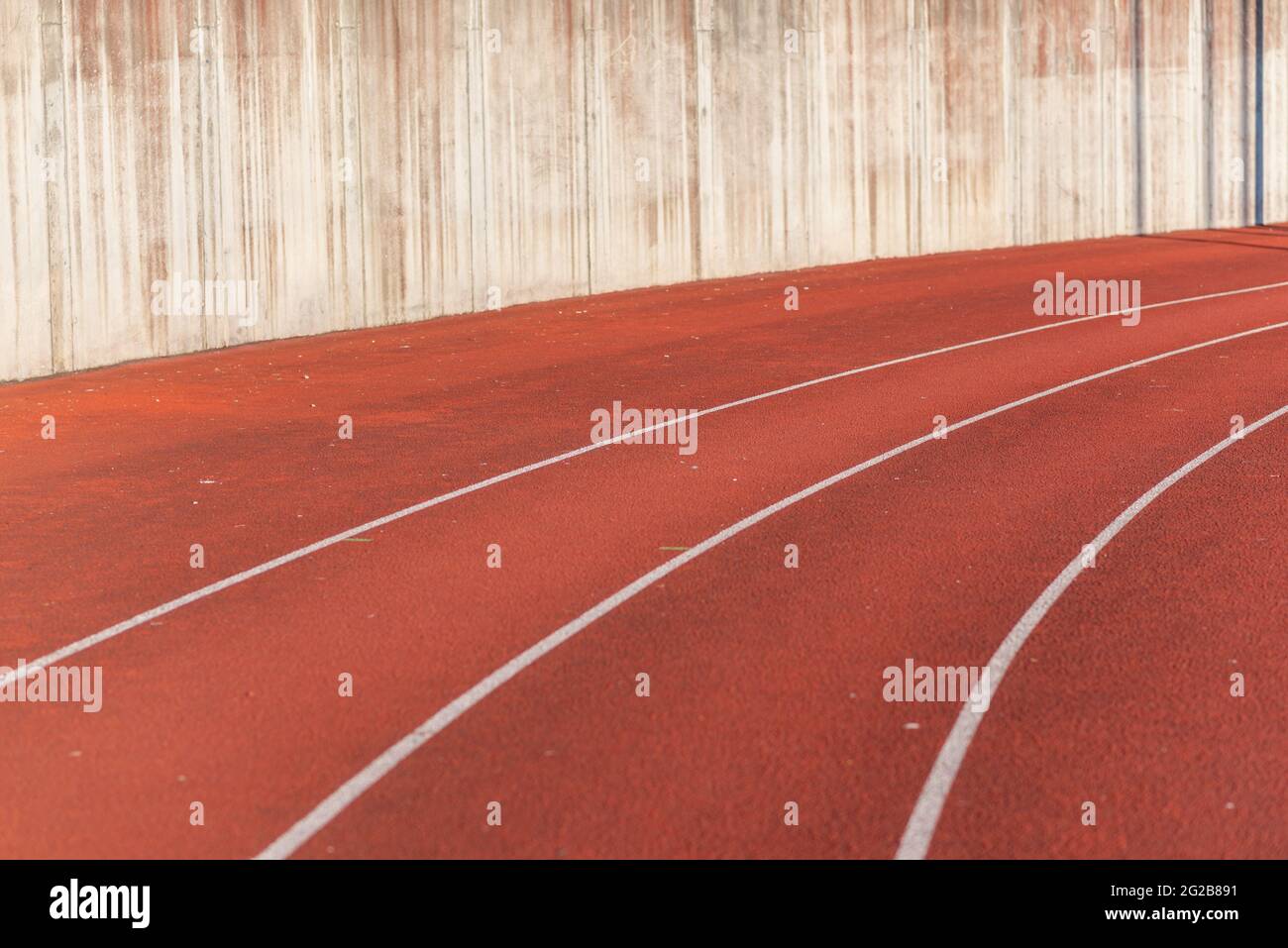 Part Red plastic track in the outdoor track and field stadium.Closeup ...