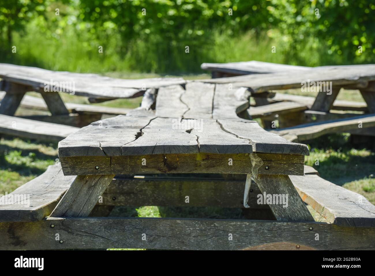 Large picnic table and bench in a sunny public park Stock Photo - Alamy
