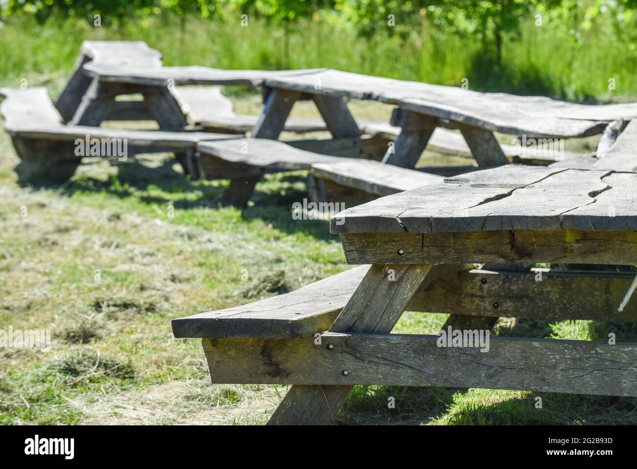 Large picnic table and bench in a sunny public park Stock Photo - Alamy