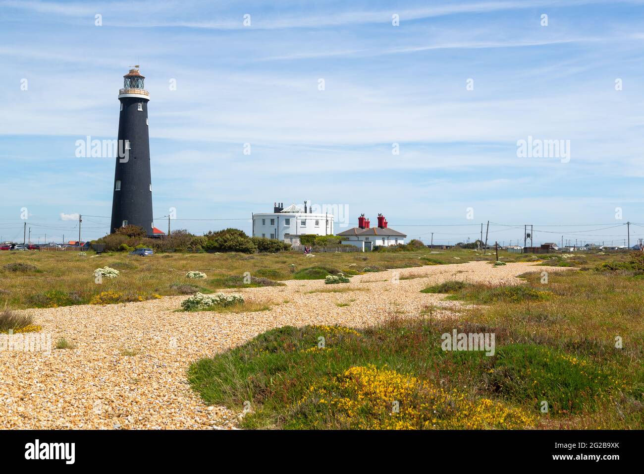 Dungeness lighthouse and pebbled beach landscape, kent, uk Stock Photo ...