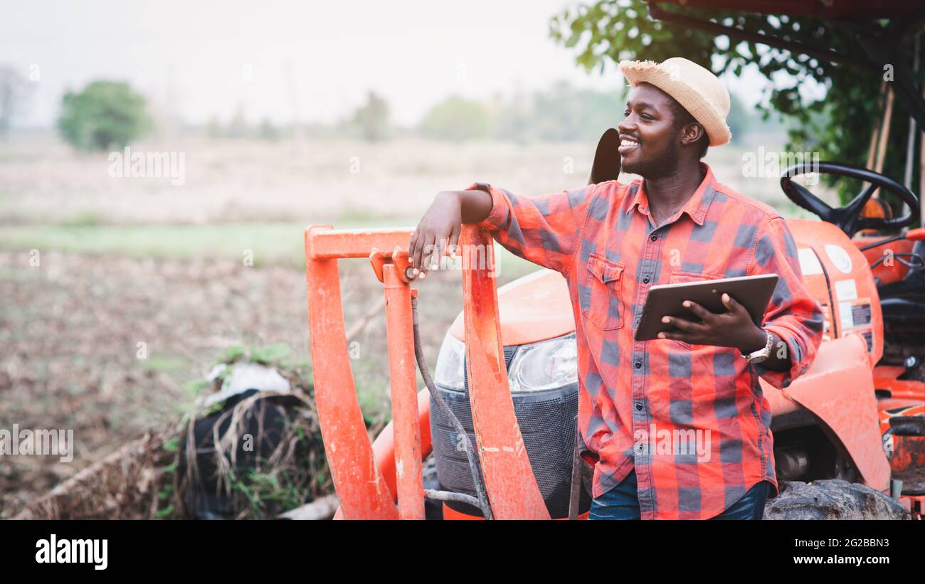 African man driving a tractor hi-res stock photography and images - Alamy