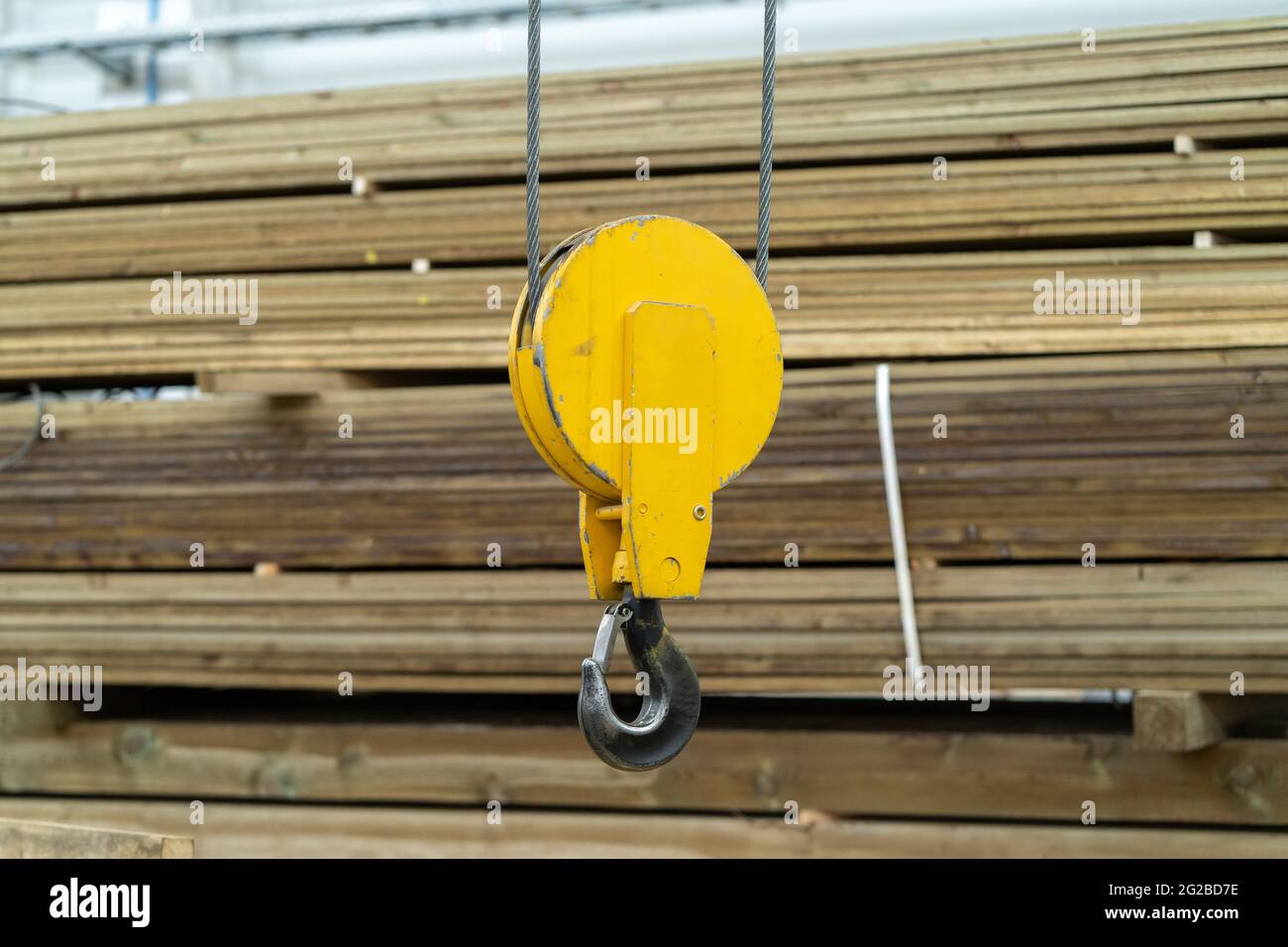 Overhead beam crane hook in factory warehouse, close up Stock Photo - Alamy