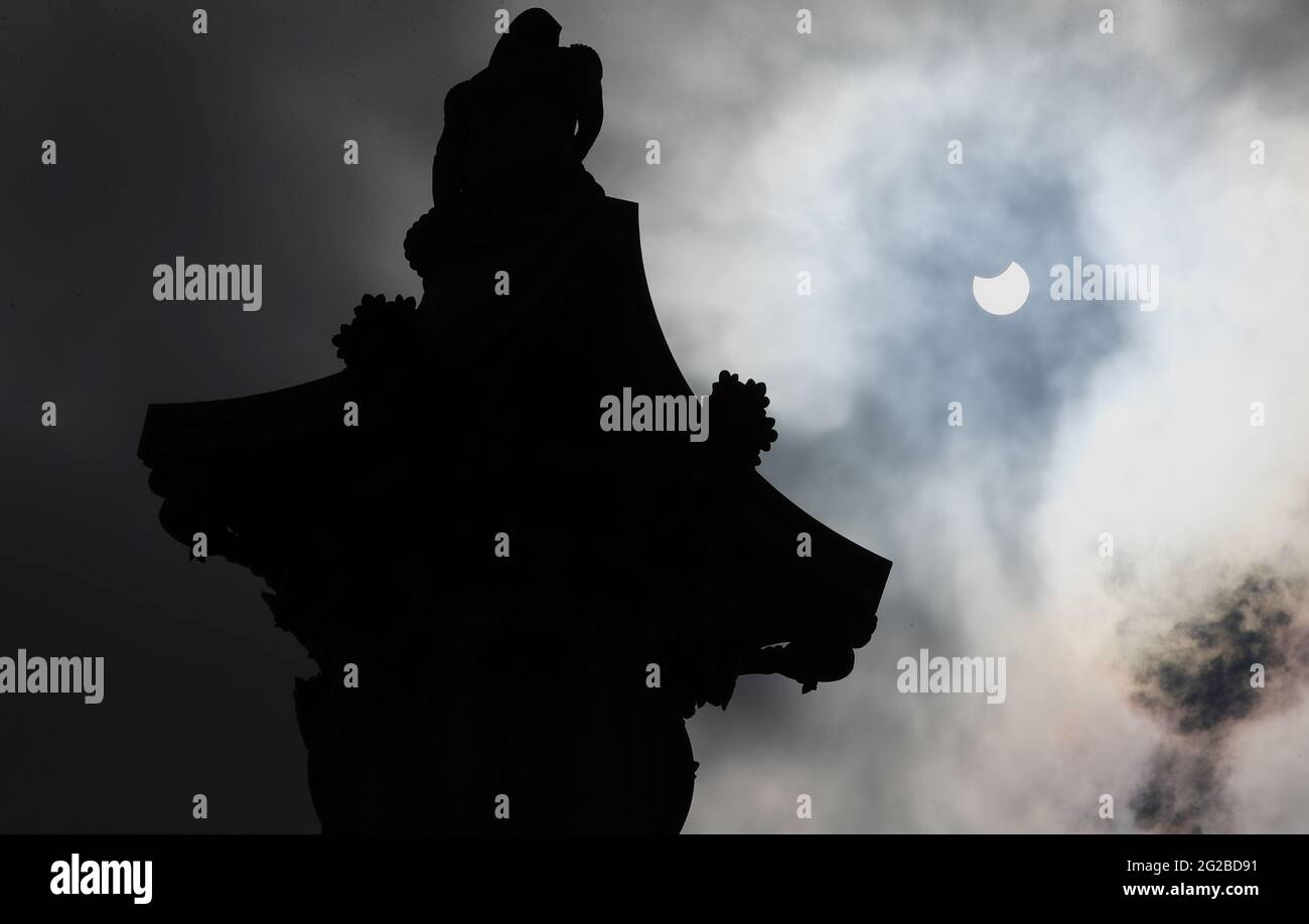 The top of Nelson's Column is silhouetted against the sky during a ...