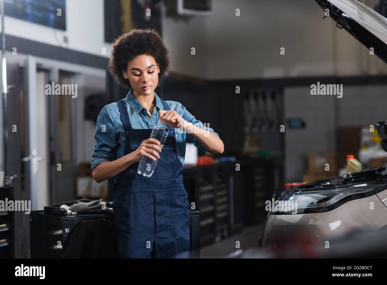 Woman opening plastic bottle hi-res stock photography and images - Alamy