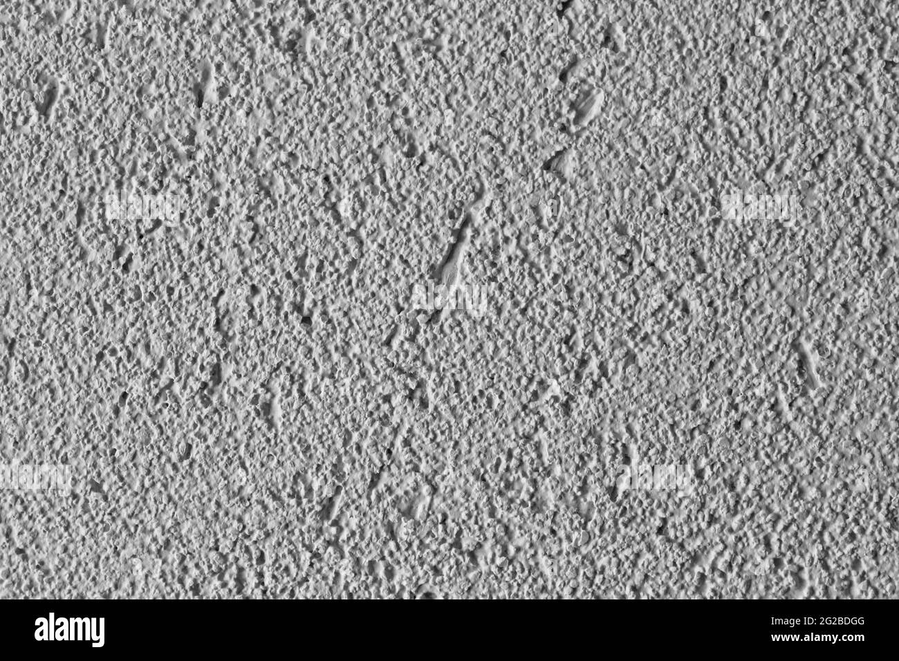 white textured background of filler paste applied with putty knife in ...