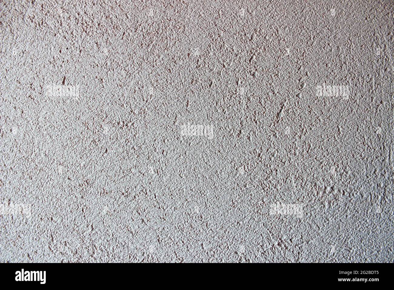 white textured background of filler paste applied with putty knife in ...